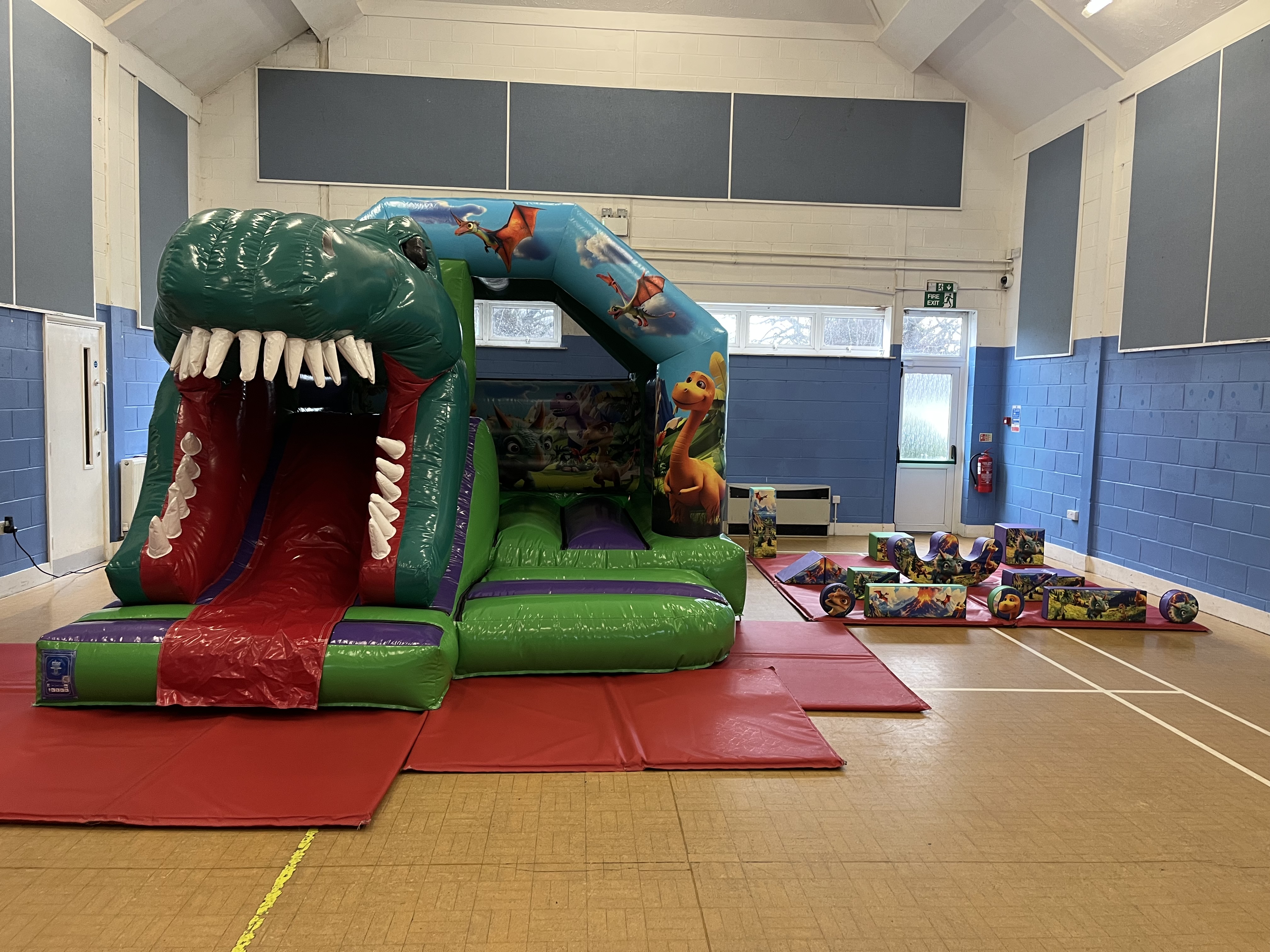 15ft x 12 ft 3D Dinosaur Bouncy Castle with slide and Dinosaur soft pl