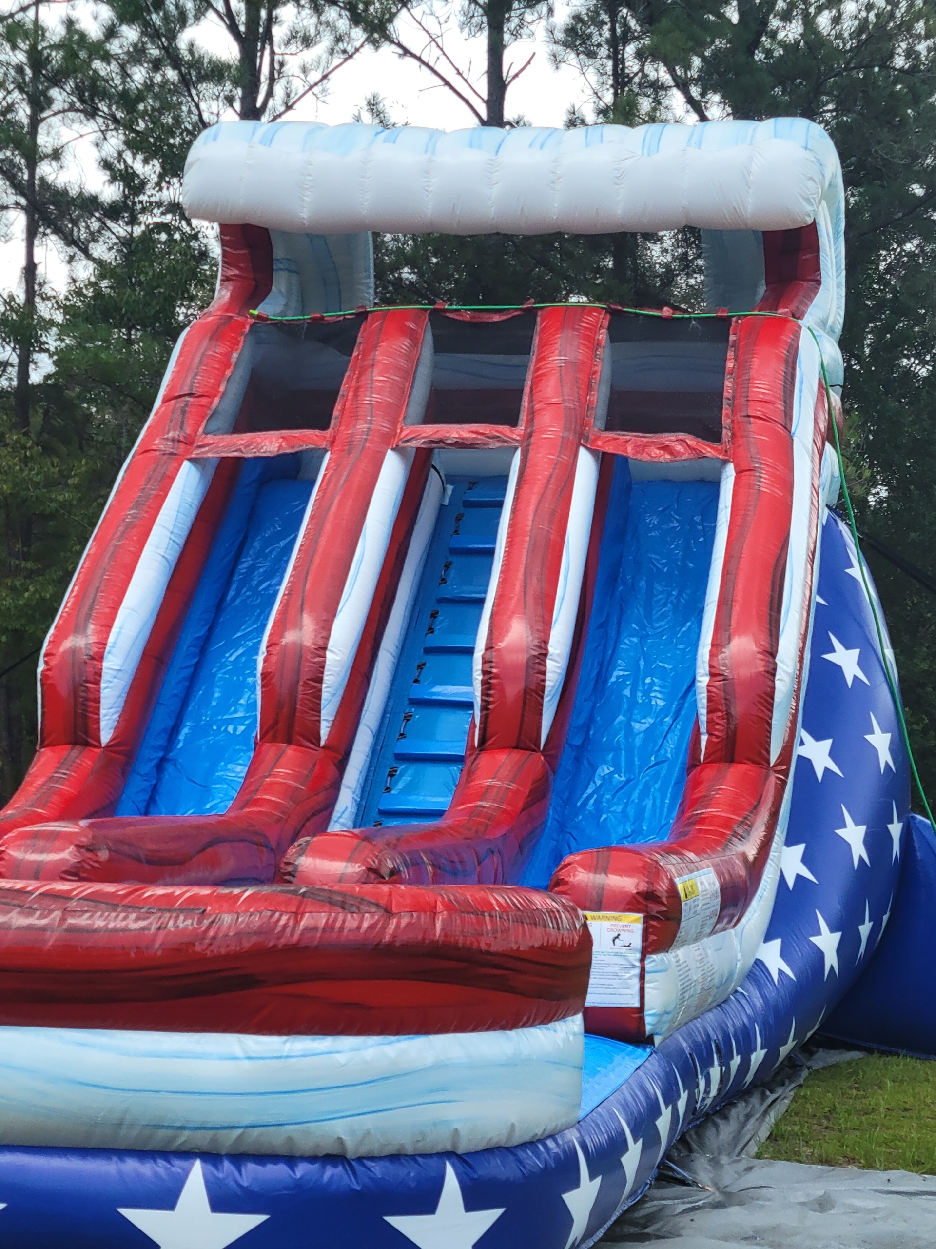Patriot 18ft double lane slide - Hire in FL | Gloria James Event Rentals