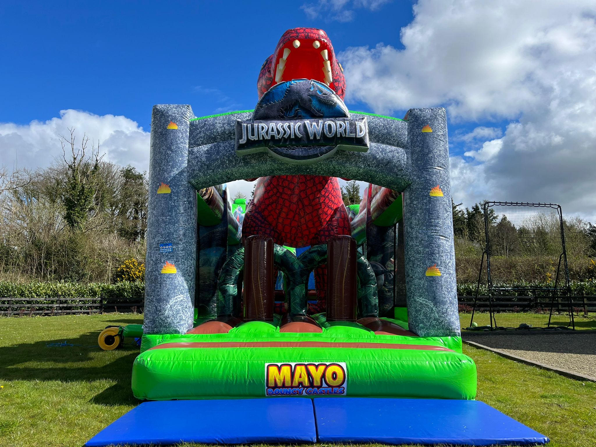 50ft Jurassic World High Slide Obstacle Course - Bouncy Castle Hire in ...