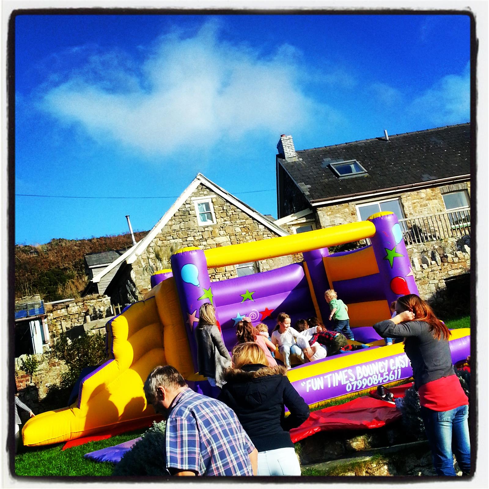 Pink & Yellow Bounce & Slide Bouncy Castle Hire Swansea