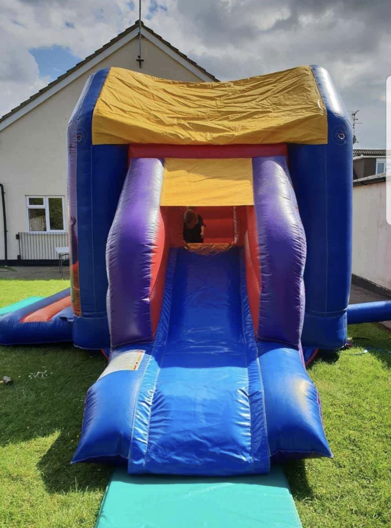 Superhero Bouncy Castle with Slide for Hire in Uxbridge, Hayes, Harrow