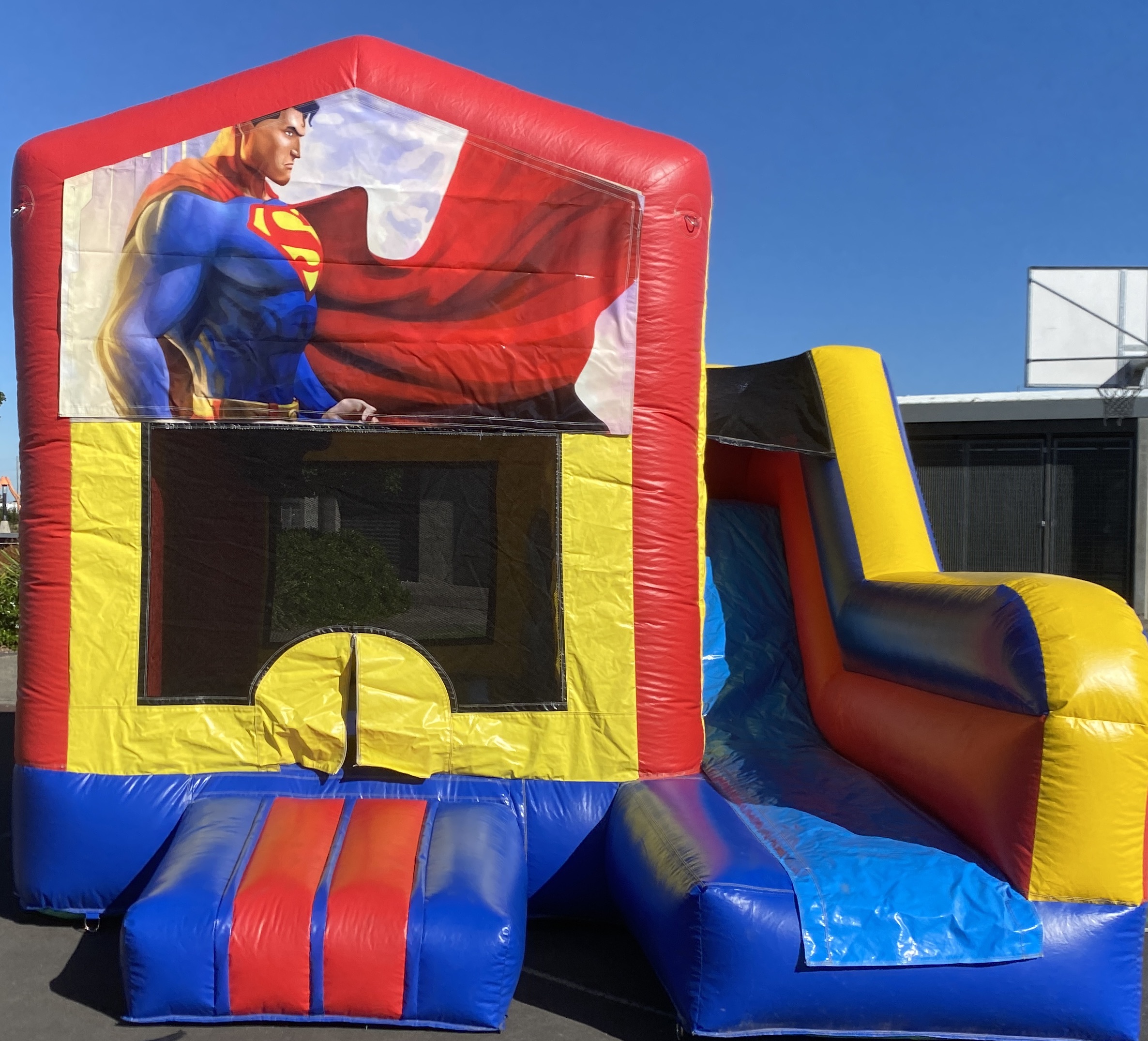 SuperMan Theme Castle with Slide - Hire in Auckland | Bounce For A Cause