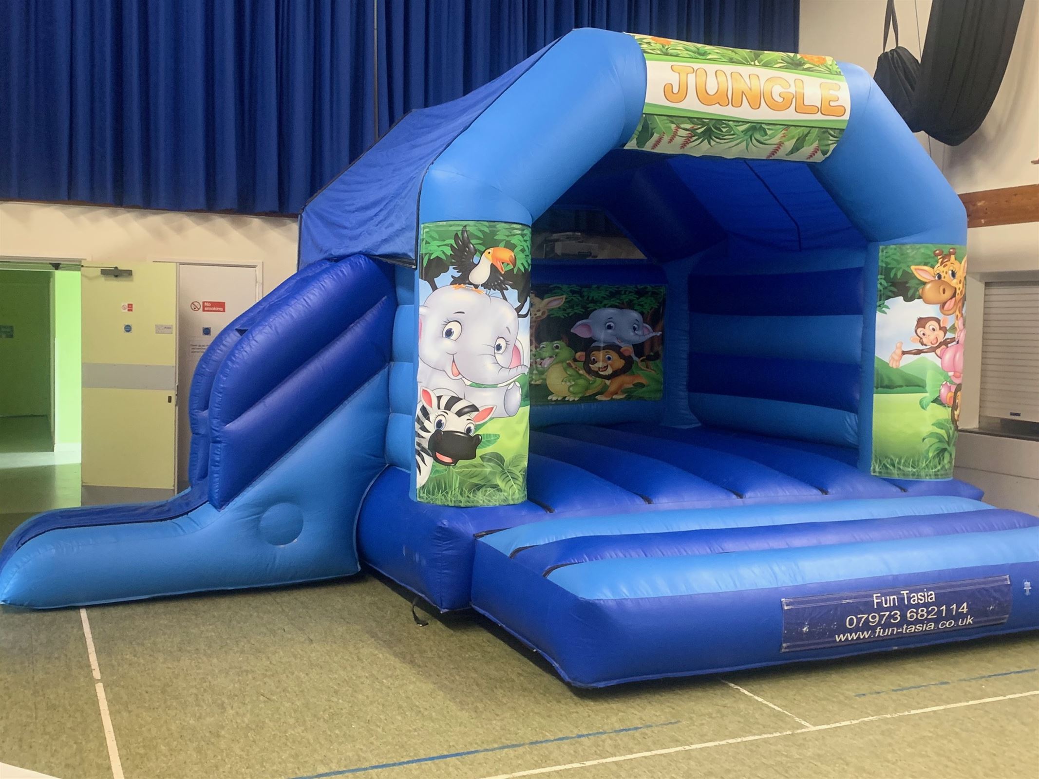 Jungle Themed Bouncy Castle with Slide - Events & Inflatable Hire ...