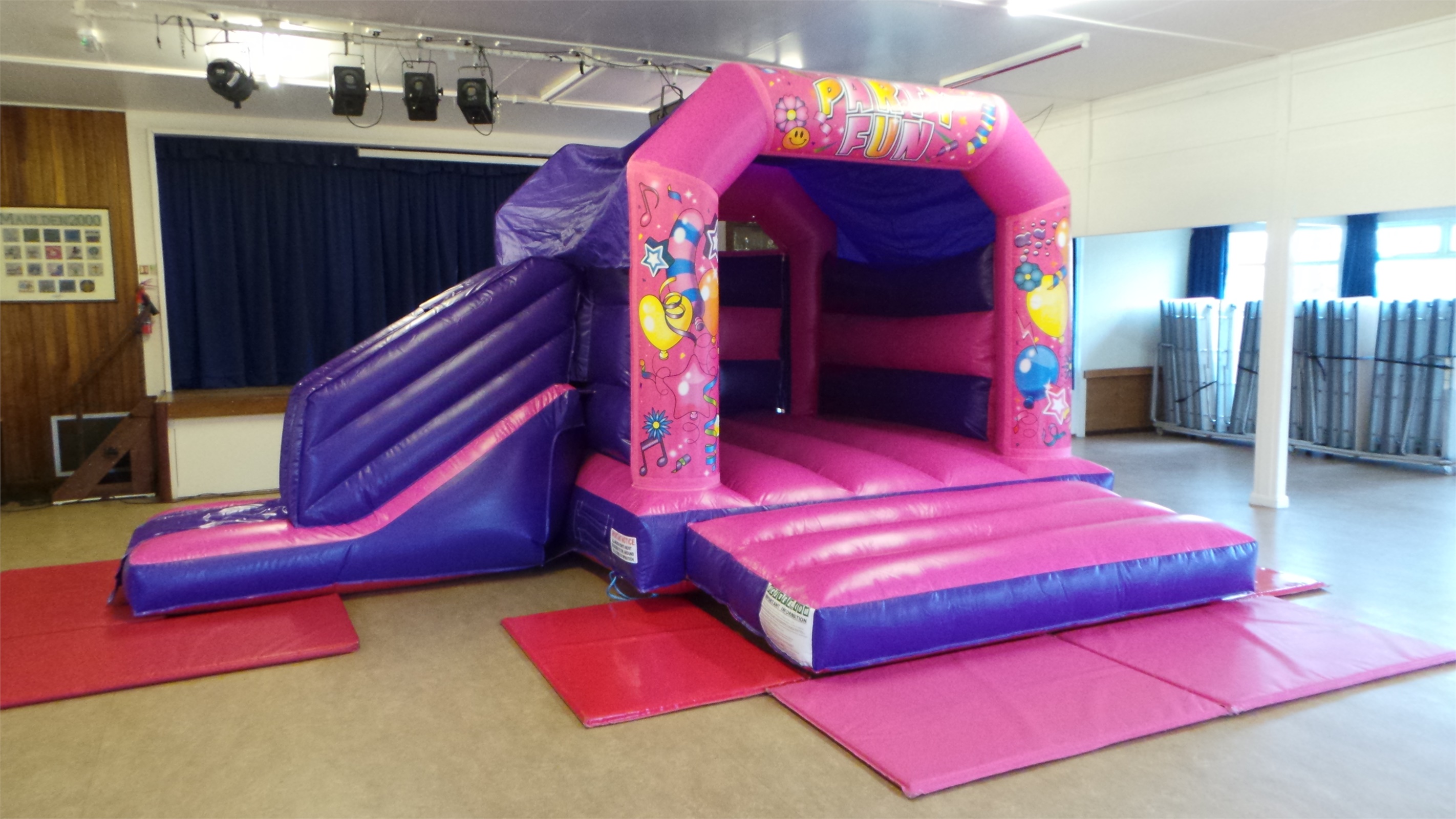 Pink & Purple Party Bouncy Castle with Slide Hire – Luton, Bedford, Mi