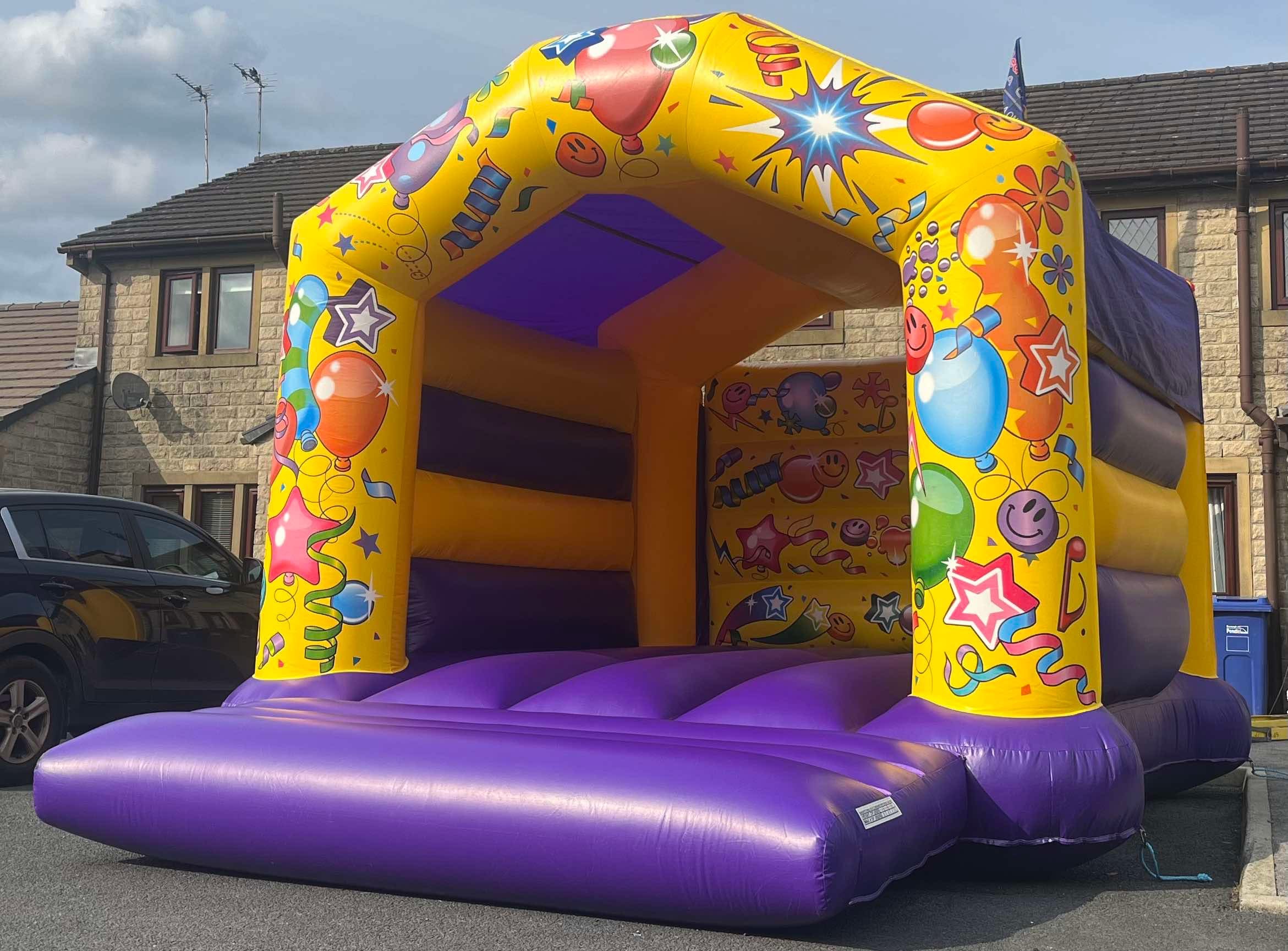 14ft x 19ft Yellow Adult Bouncer - Hire in northampton | elliotts castles