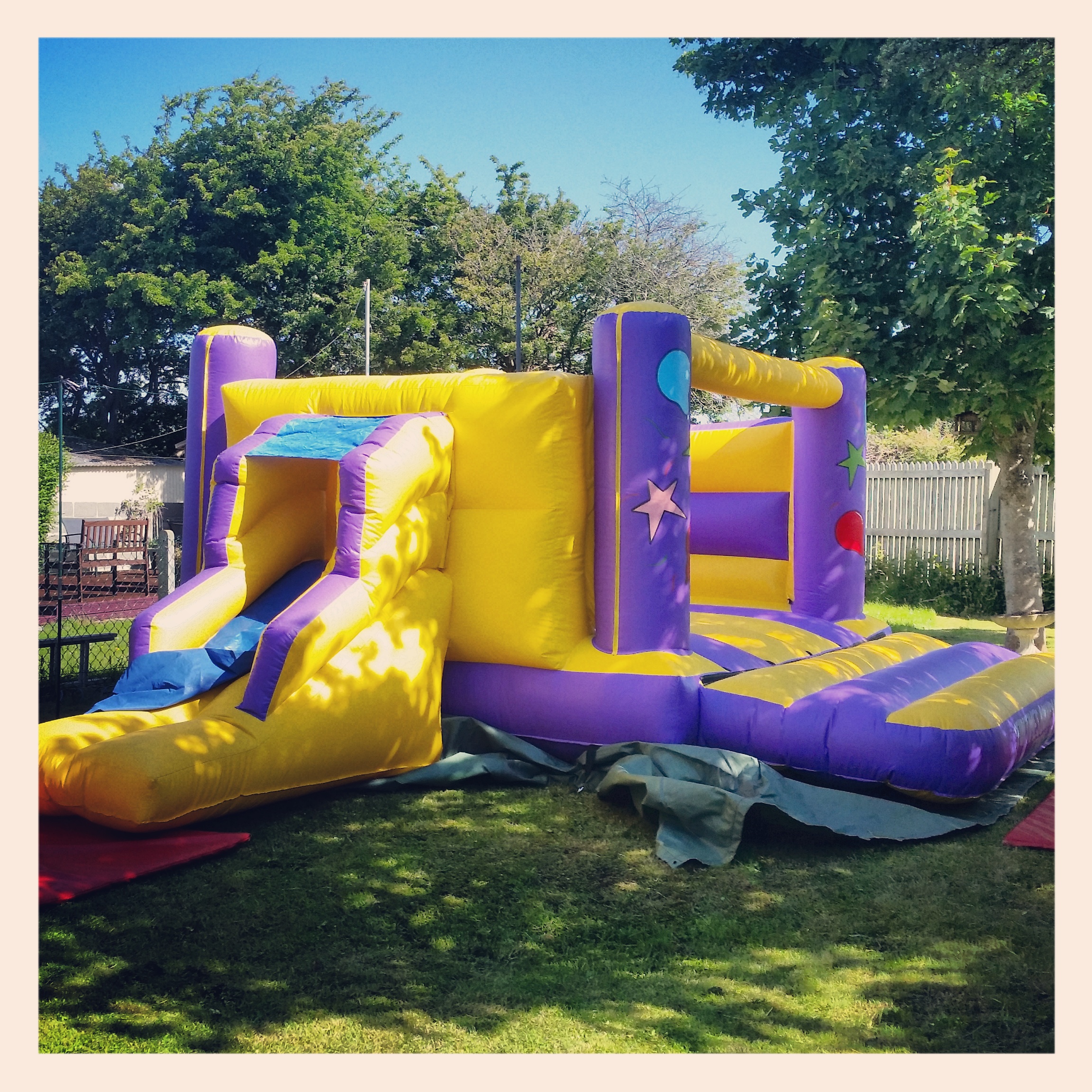 Pink & Yellow Bounce & Slide Bouncy Castle Hire Swansea