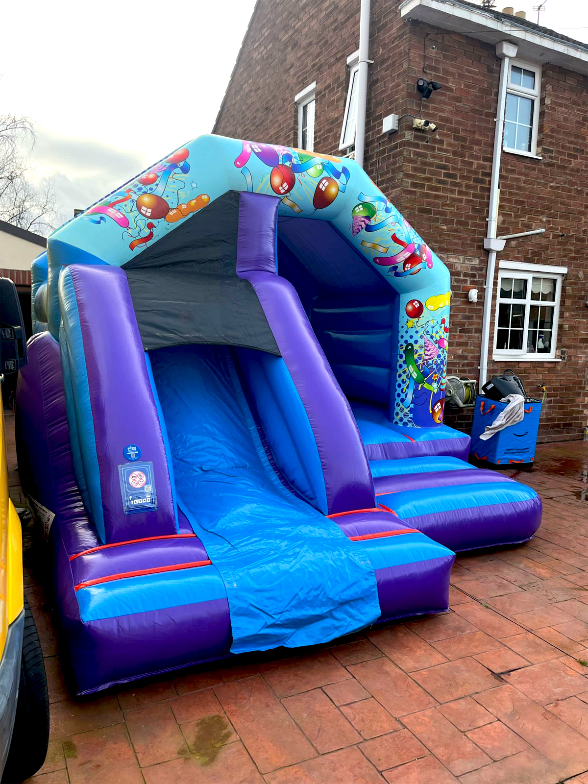 Celebration Front Slide Bouncy Castle Hire in Widnes and surrounding