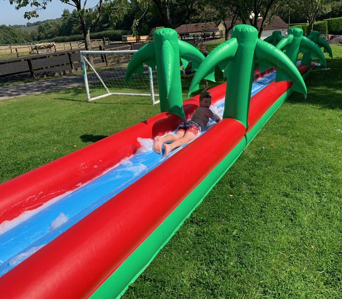 Water Slide Single Lane Inflatable 60ft x 9ft - Bouncy Castle Hire in ...