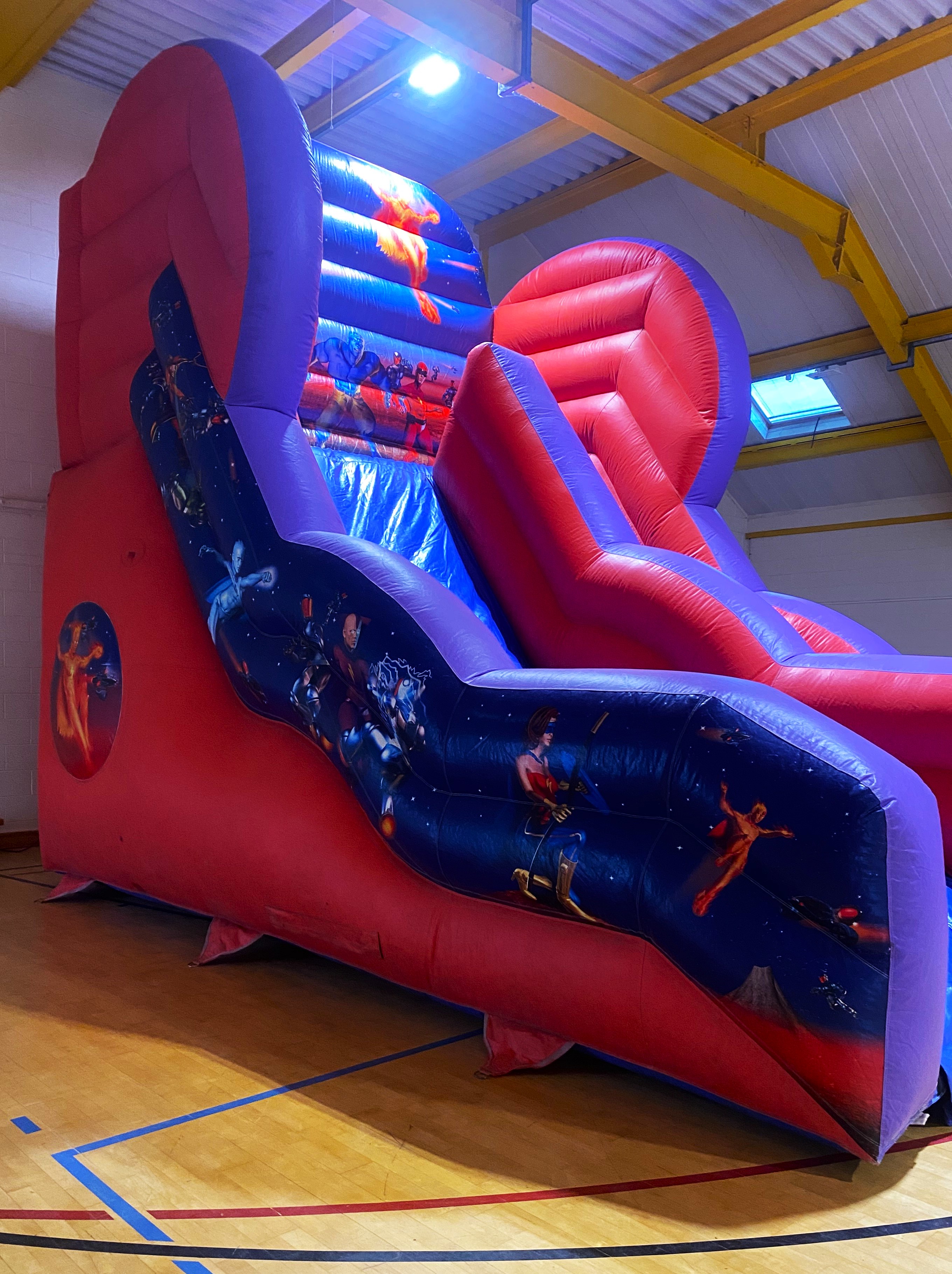 Action Heroes inflatable Slide hire | Arnie's Castles Stoke