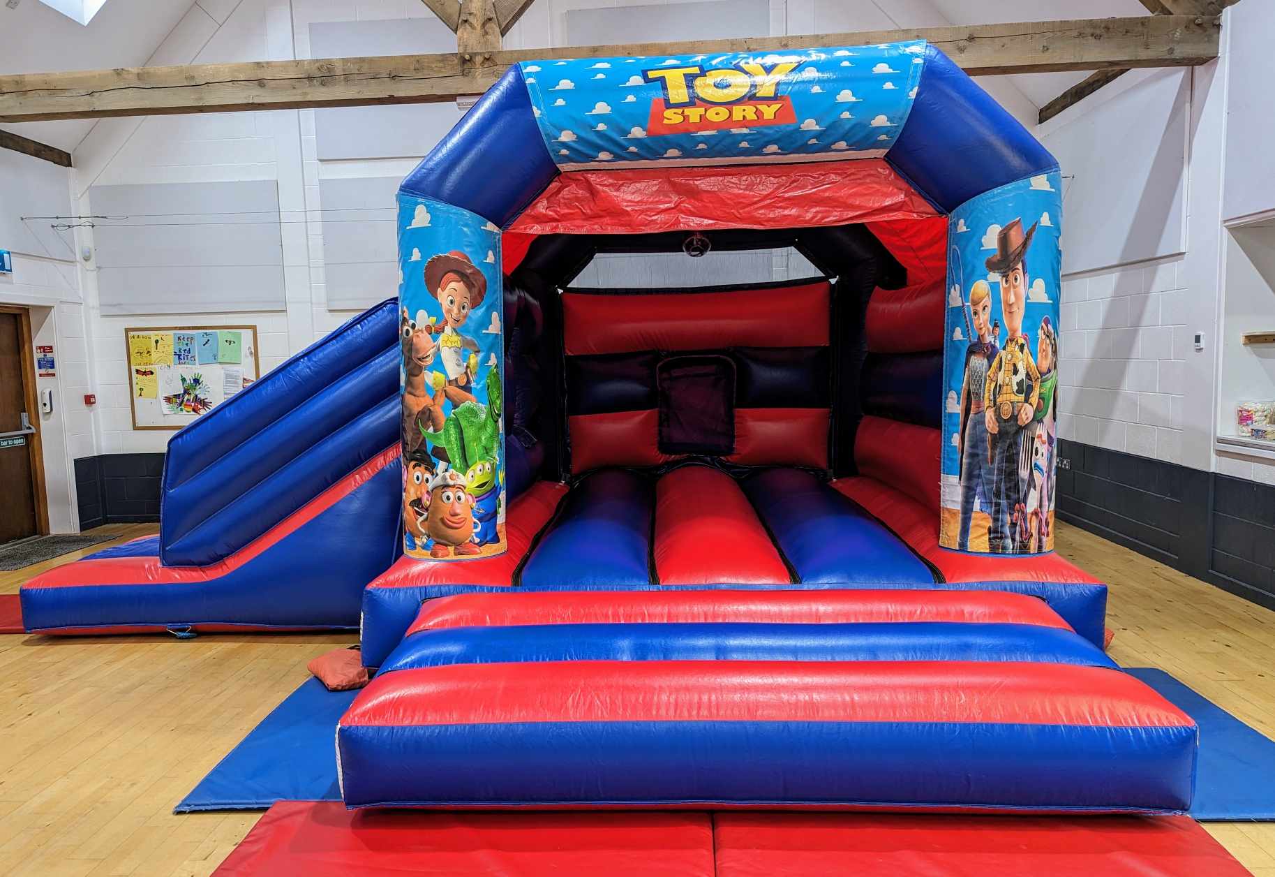 Red/Blue Toy Story Bouncy Castle with Side Slide - Bouncy Castle Hire ...