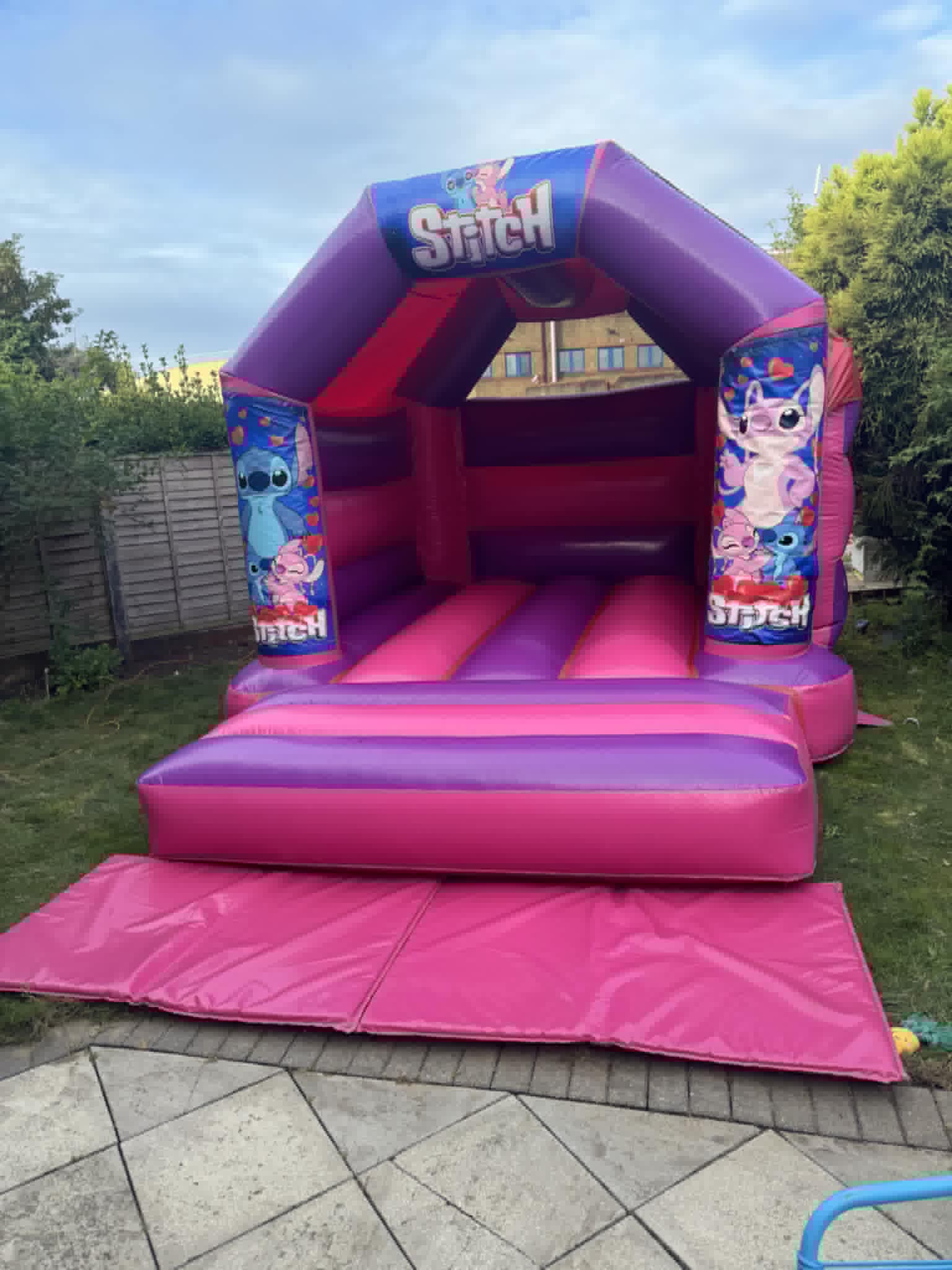 Pink / Purple Castle - Stitch and Lilo - Inflatables Hire in London ...