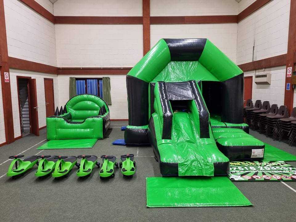 Green and black bouncy castle package hire Torquay