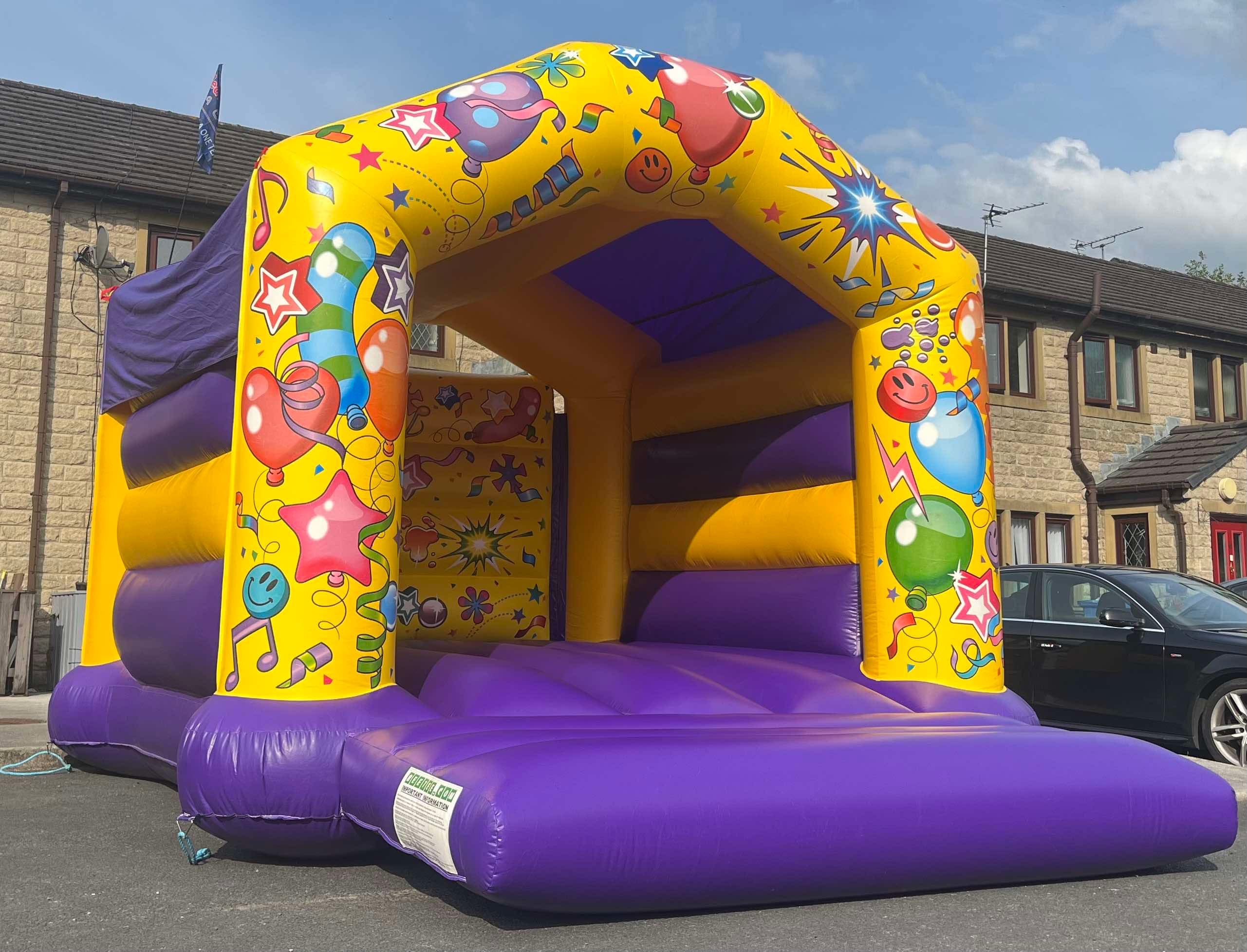 14ft x 19ft Yellow Adult Bouncer - Hire in northampton | elliotts castles