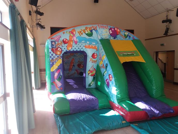 Jump and Slide Party Theme Bouncy castle with Balloons on