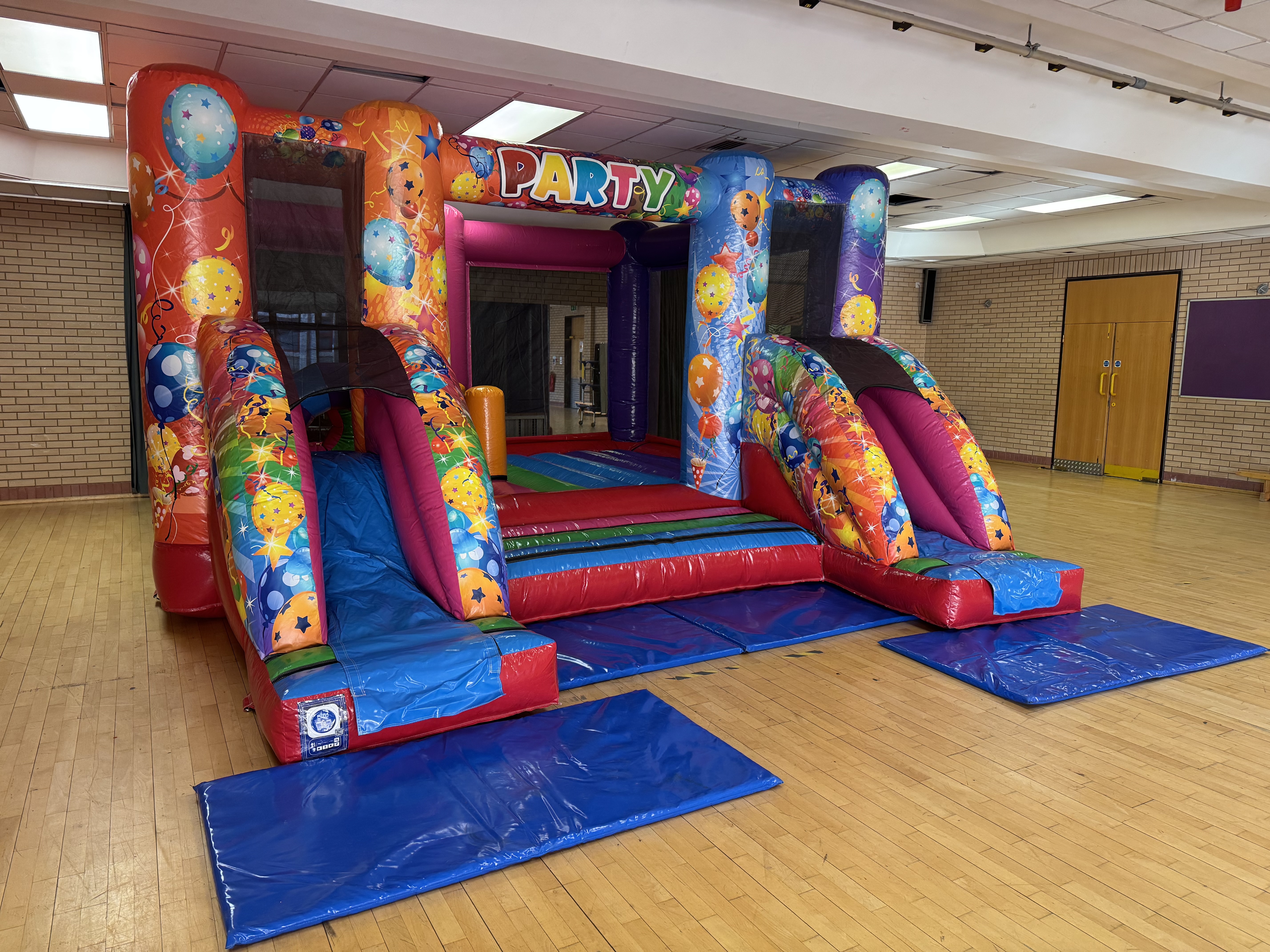 Multicoloured Low Height Double Front Slide Party Castle - Event Hire ...
