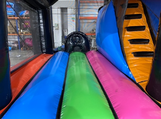 Multi Coloured kingdom Castle Disco - Bouncy Castle and Marquee hire in ...